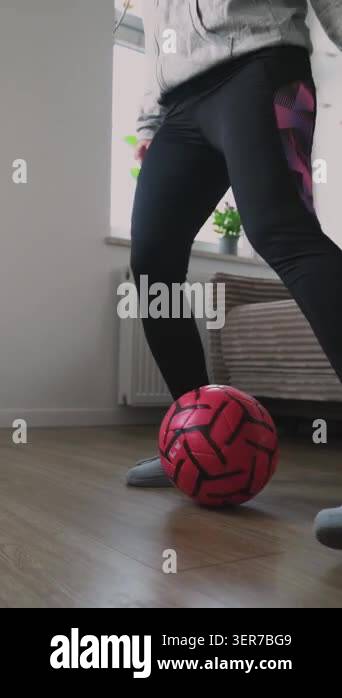 Girl Training At Home By Rolling A Ball From One Foot To The Other ...