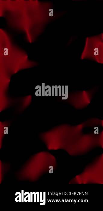 Vertical abstract dark red and black fluid motion background. Slow ...