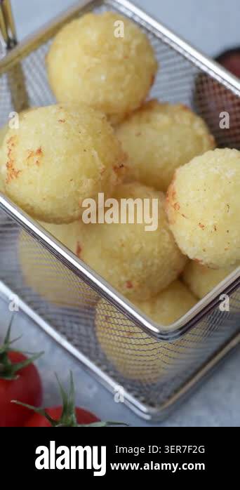 Cheese balls or potato croquettes, golden brown, fried with salt and ...