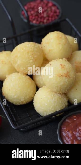 Cheese balls or potato croquettes, golden brown, fried with salt and ...