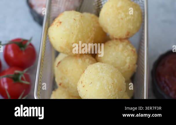 Cheese balls or potato croquettes, golden brown, fried with salt and ...