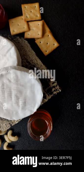 Brie or Camembert cheese is a white, round shape for baking and melting ...