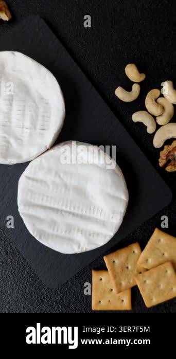 Brie or Camembert cheese is a white, round shape for baking and melting ...