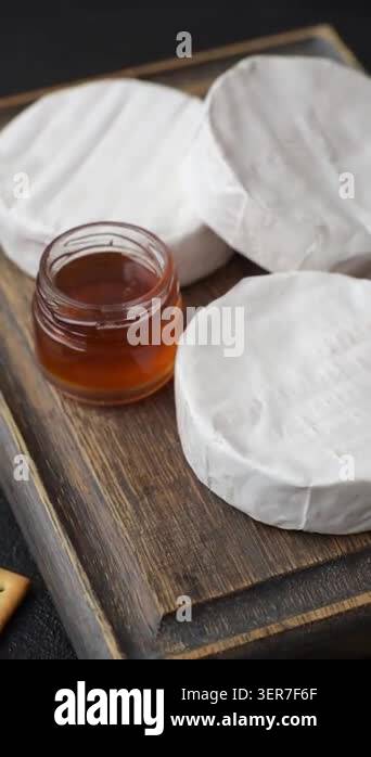 Brie or Camembert cheese is a white, round shape for baking and melting ...