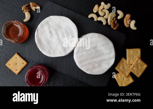 Brie or Camembert cheese is a white, round shape for baking and melting ...
