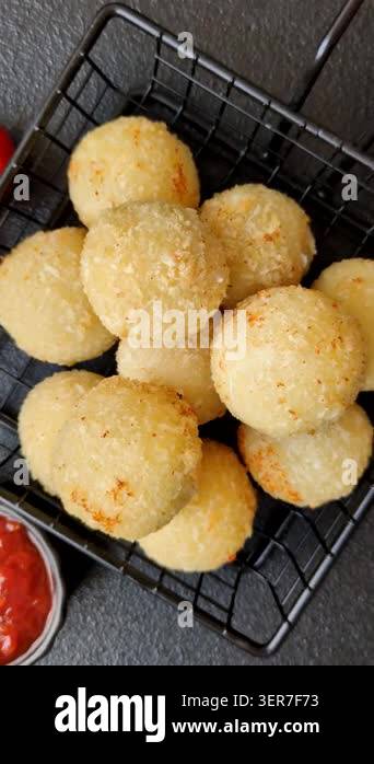 Cheese balls or potato croquettes, golden brown, fried with salt and ...