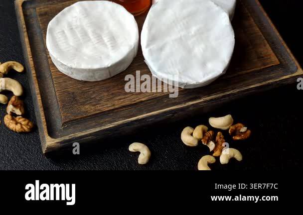 Brie or Camembert cheese is a white, round shape for baking and melting ...
