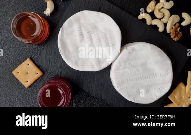 Brie or Camembert cheese is a white, round shape for baking and melting ...