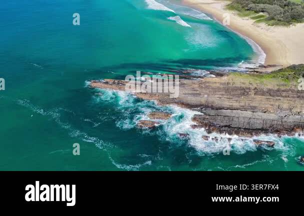 Aerial video panning around Bennetts Headland and the prominent sand ...