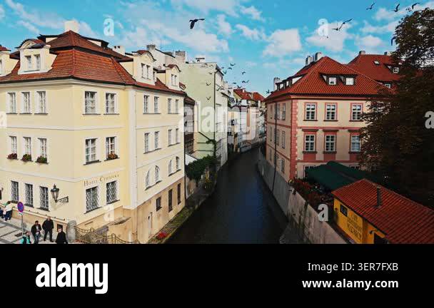 Prague. Czech Republic - 12 October 2024: Tourists stroll by the famous ...