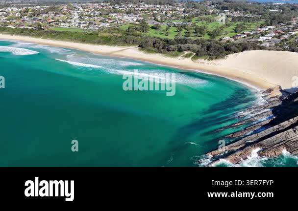 Aerial video flying over Bennetts Head at One Mile Beach near Forster ...