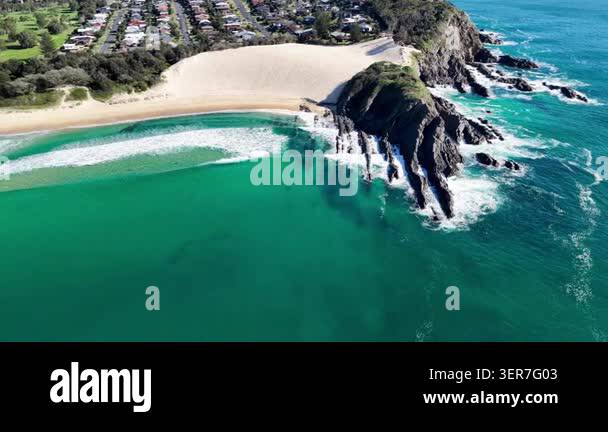 Aerial video panning around Bennetts Headland and the prominent sand ...