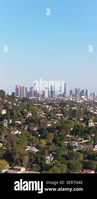 Los Angeles skyline rising above Hollywood hills residential ...