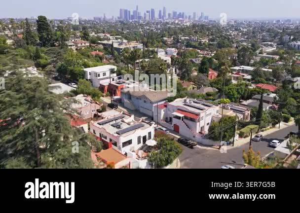 Hollywood Hills suburban homes with downtown Los Angeles skyline in ...