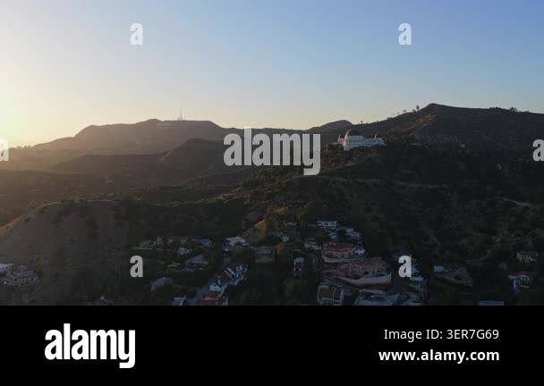 Golden hour light illuminating Hollywood Hills with Griffith ...