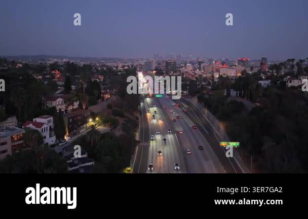 Hollywood Freeway with traffic and downtown Los Angeles skyline at dusk ...