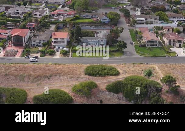Luxurious hillside mansions and estates featuring swimming pools and ...