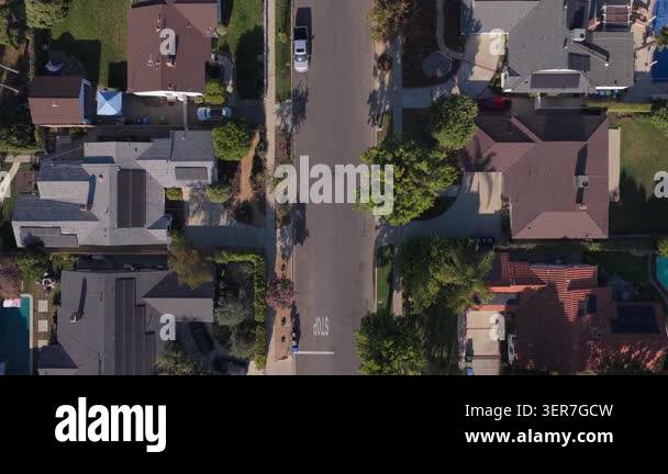 Top down vertical reveal of a Los Angeles suburban neighborhood with ...