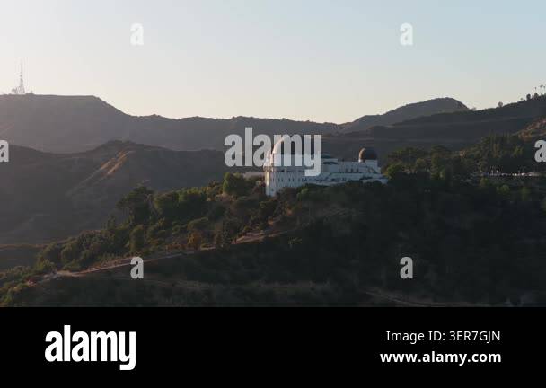 Griffith Observatory orbiting with Hollywood Sign and Los Angeles in ...