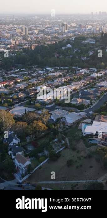 Mansions and real estate overlooking Los Angeles, California cityscape ...