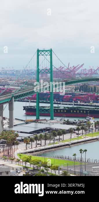 Cars crossing Vincent Thomas Bridge over busy Port of Los Angeles with ...
