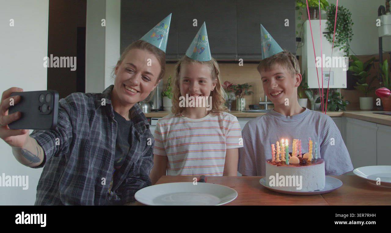 Happy family taking selfie during birthday celebration at home Stock ...