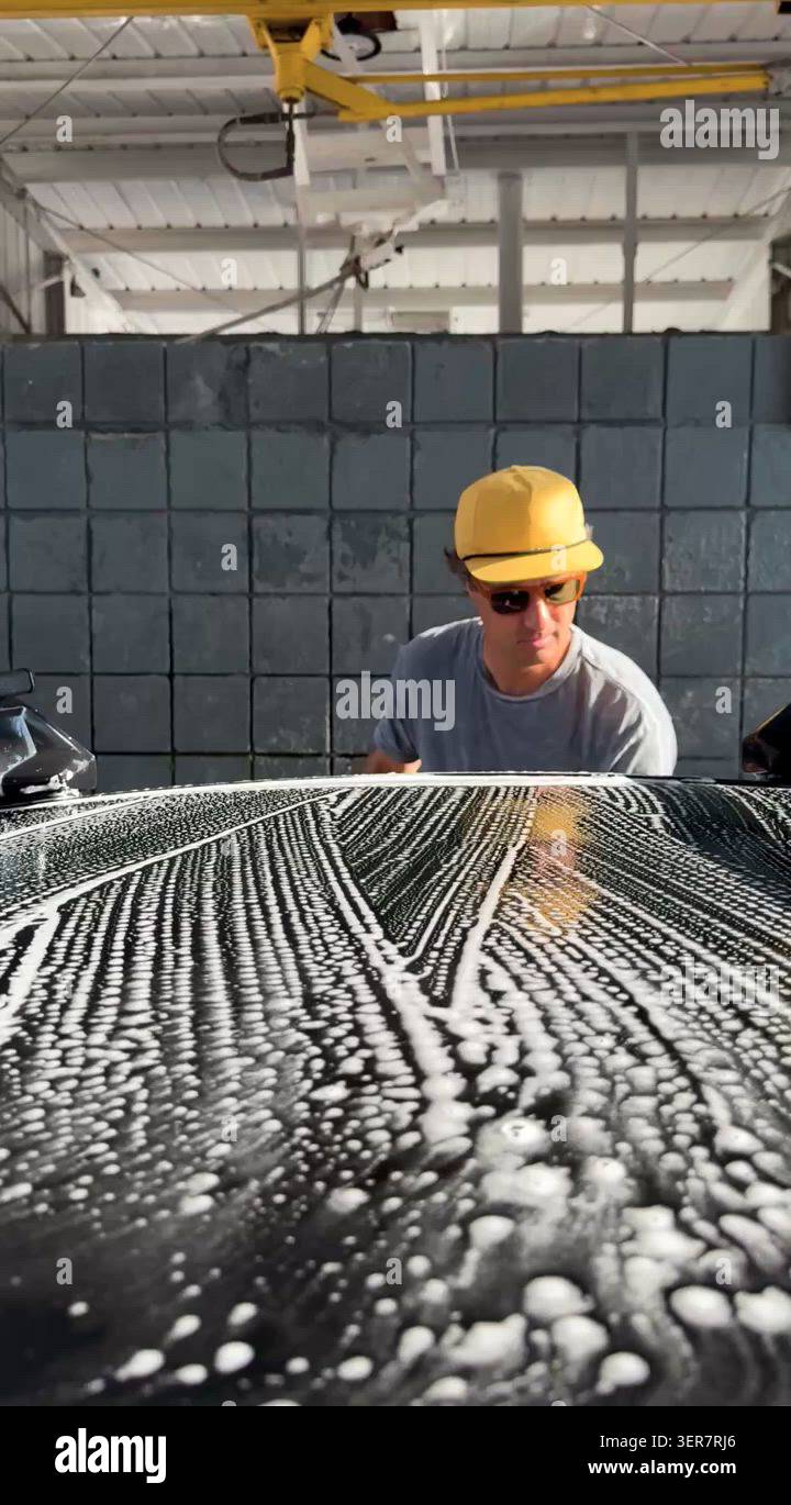 Man Washing Car on Sunny Day Stock Video Footage - Alamy