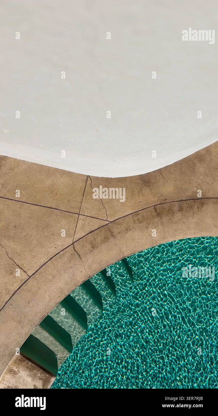 from above: pool with light playing on its surface and negative space ...