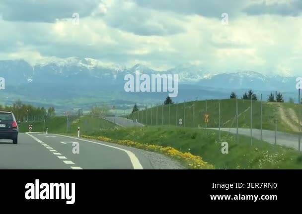 Approaching Zakopane by car with panoramic views of rolling hills and ...
