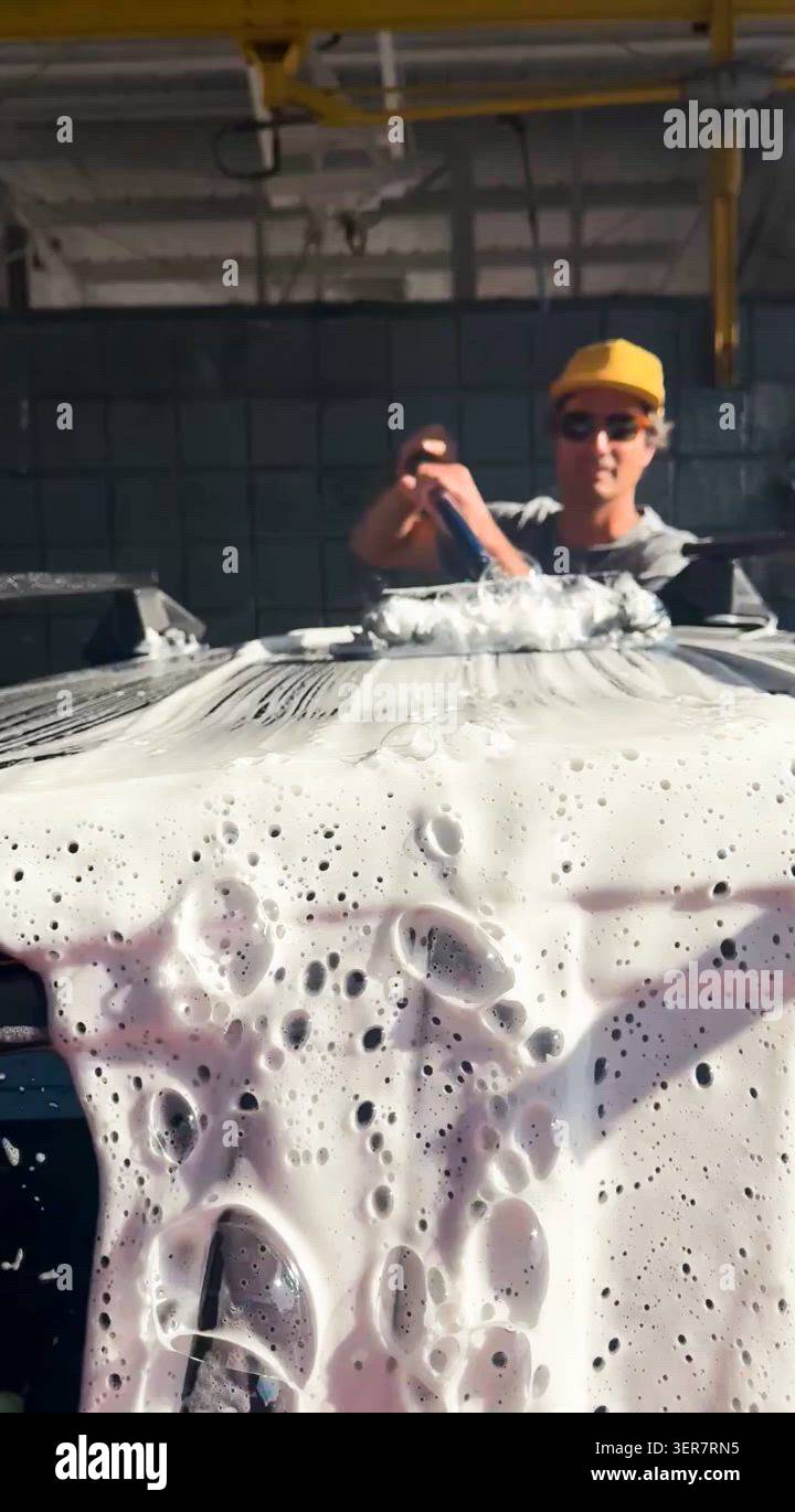 Man Washing Car on Sunny Day Stock Video Footage - Alamy