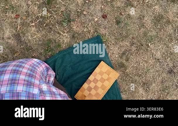 Father and daughter playing games together in a backyard on a warm ...