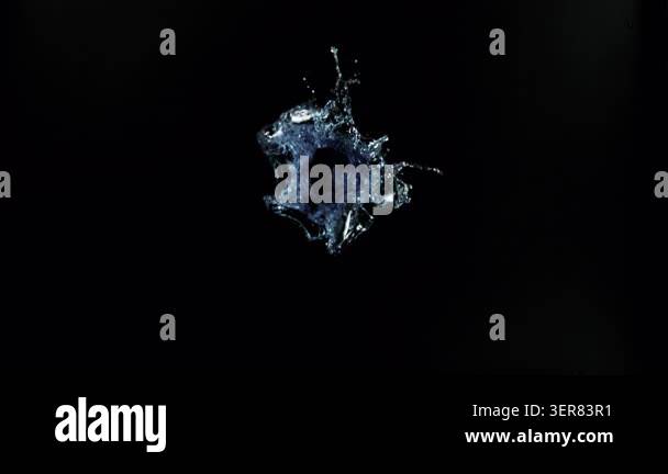 Super Slow Motion of Splashing Water Isolated on Black Background ...