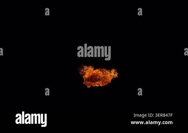 Small fire explosion with glowing sparks and embers isolated on a black ...