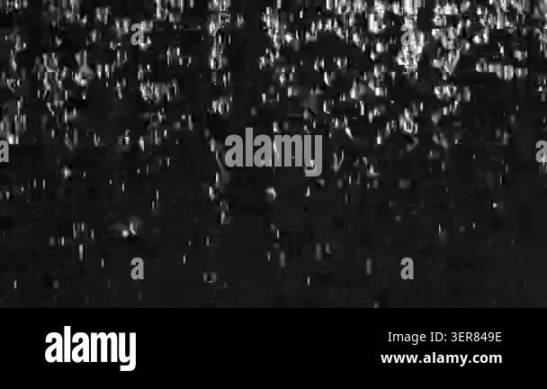 Abstract streams of falling water droplets cascade against a black ...