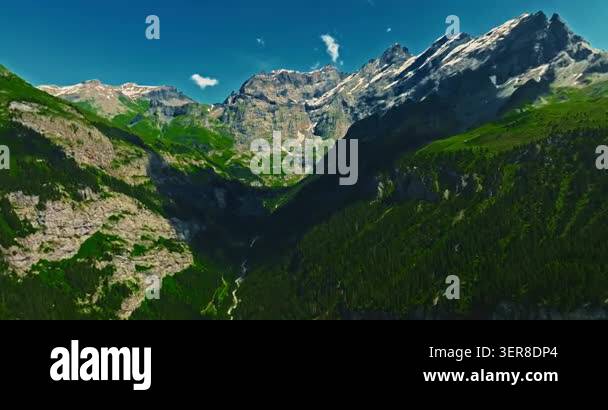 Establishing shot of Switzerland. Aerial view of the green meadows of ...