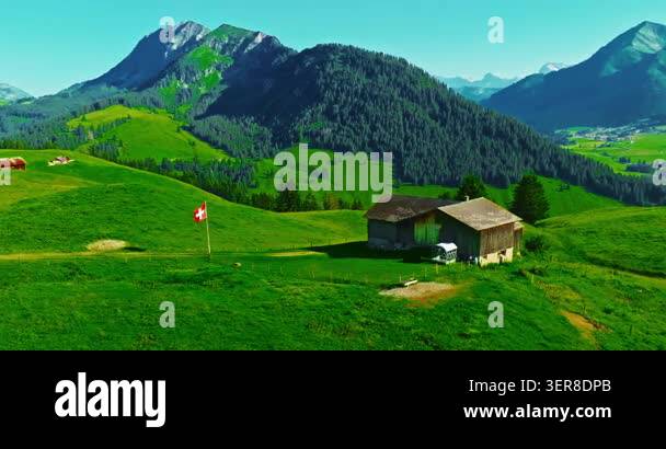 Establishing shot of Switzerland. Aerial view of the green meadows of ...