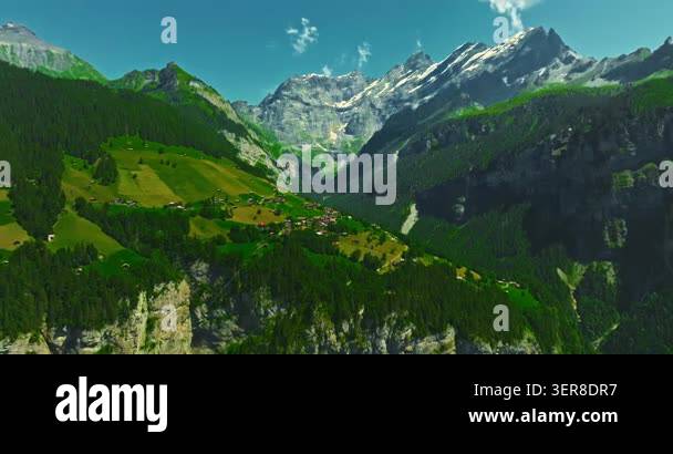 Establishing shot of Switzerland. Aerial view of the green meadows of ...