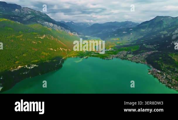 Establishing shot of Switzerland. Aerial view of the green meadows of ...