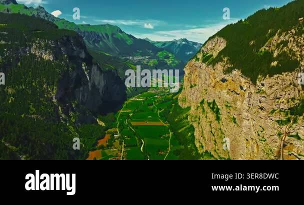 Establishing shot of Switzerland. Aerial view of the green meadows of ...