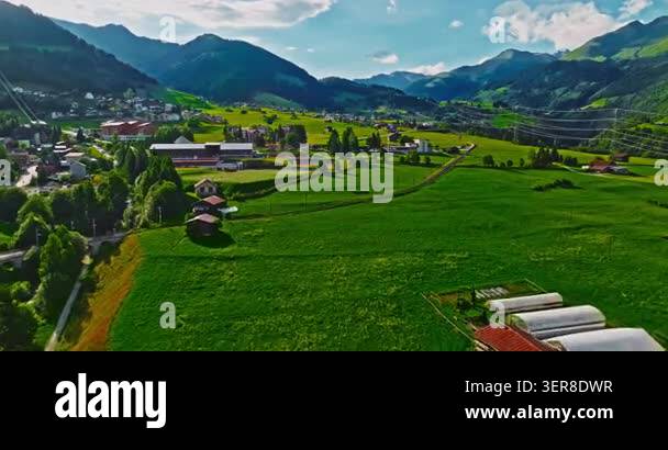 Establishing shot of Switzerland. Aerial view of the green meadows of ...