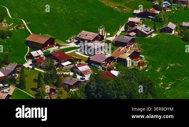 Establishing shot of Switzerland. Aerial view of the green meadows of ...