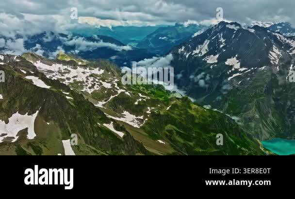 Establishing shot of Switzerland. Aerial view of the green meadows of ...