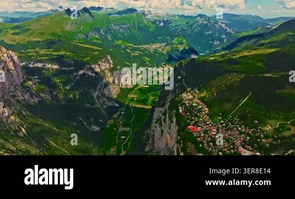 Establishing shot of Switzerland. Aerial view of the green meadows of ...