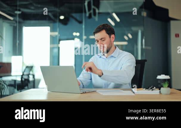 Close-up of exhausted businessman or IT specialist feeling neck pain or ...