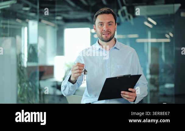 Happy property owner, broker or landlord holding key to new home or ...