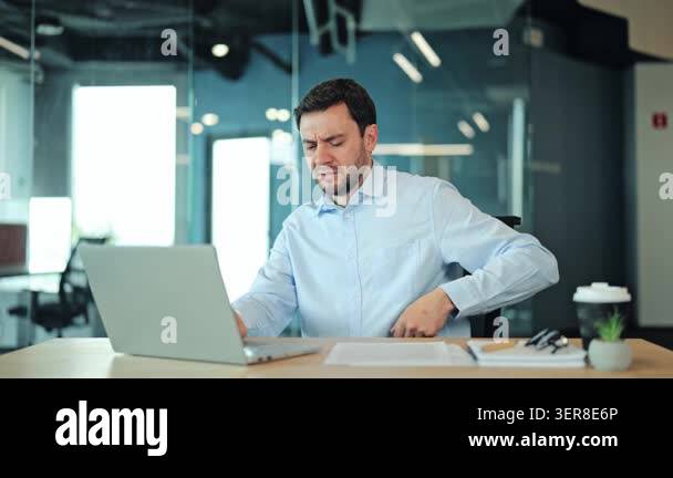 Close up of corporate manager or IT specialist suffering from backache ...