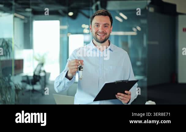 Happy real estate agent, landlord or executive holding key to ...
