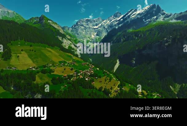 Establishing shot of Switzerland. Aerial view of the green meadows of ...