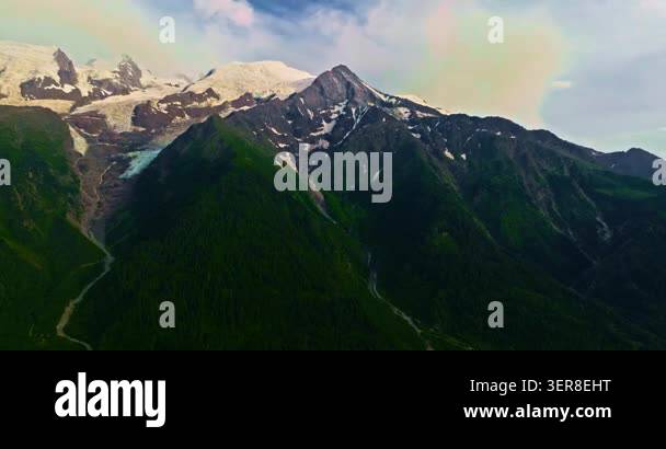 Establishing shot of French mountains in summer. Drone view of green ...