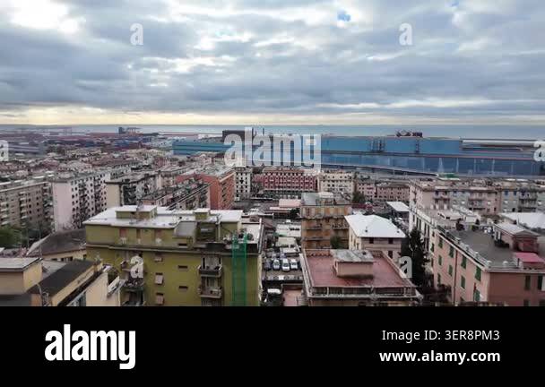 An expansive high-angle view of Genoa, Italy, revealing dense ...
